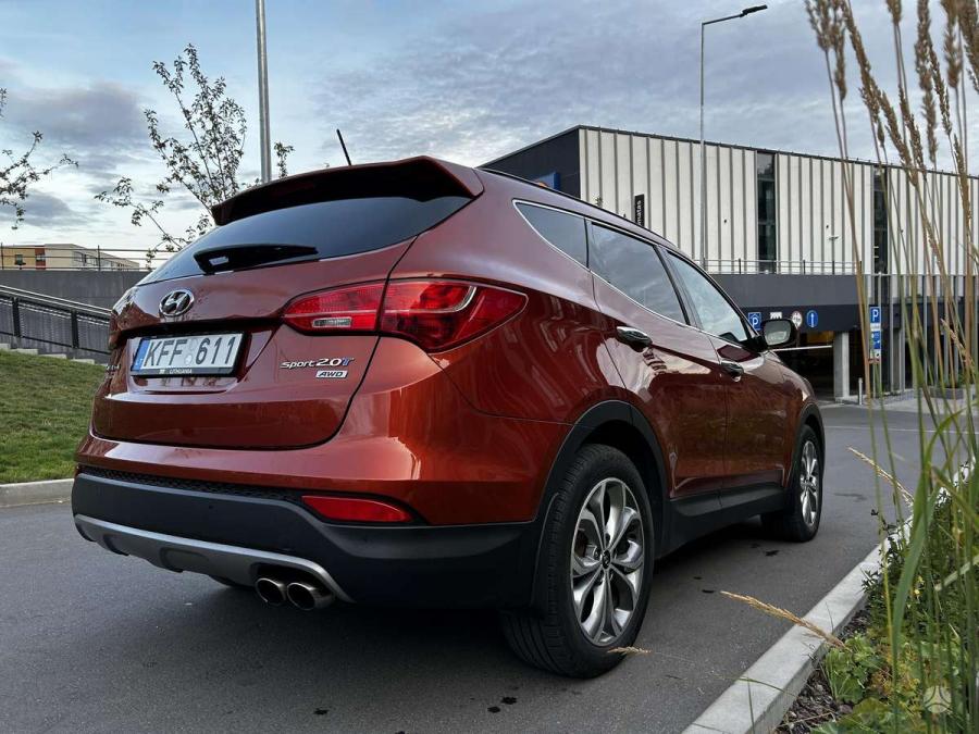 Orange Hyundai Santa Fe 2015 in Vilnius, with an engine capacity of 2.00 L and mileage of 100 thousand km for 12999 €, photo 6 on AUTOMOTO.COM.LV