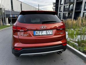 Orange Hyundai Santa Fe 2015 in Vilnius, with an engine capacity of 2.00 L and mileage of 100 thousand km for 12999 €, photo 7 on AUTOMOTO.COM.LV