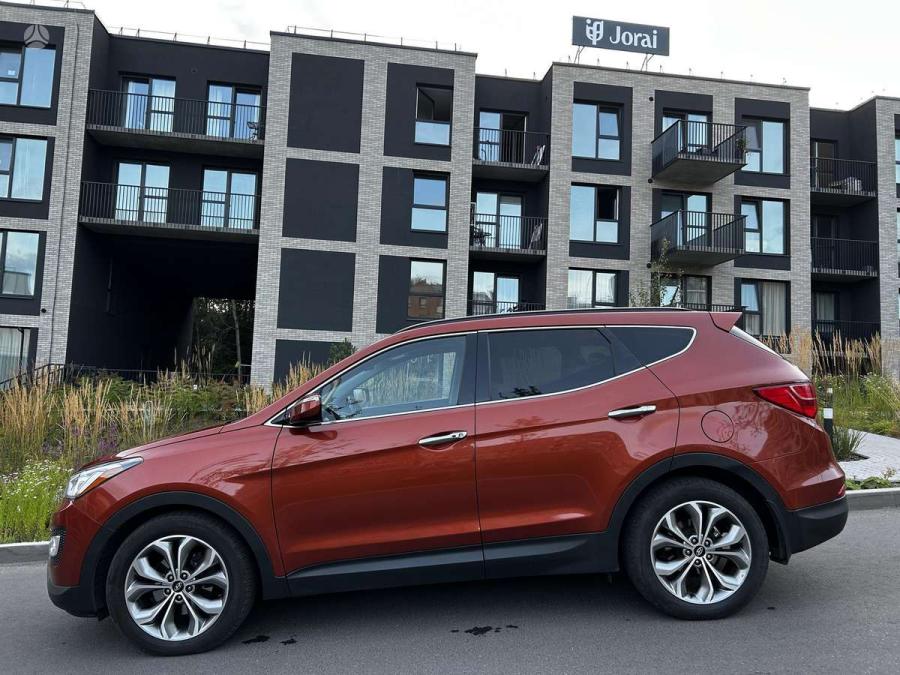 Orange Hyundai Santa Fe 2015 in Vilnius, with an engine capacity of 2.00 L and mileage of 100 thousand km for 12999 €, photo 8 on AUTOMOTO.COM.LV