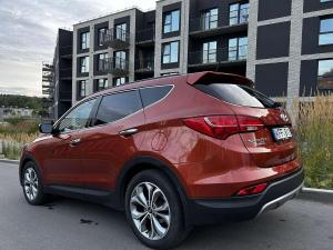 Orange Hyundai Santa Fe 2015 in Vilnius, with an engine capacity of 2.00 L and mileage of 100 thousand km for 12999 €, photo 9 on AUTOMOTO.COM.LV