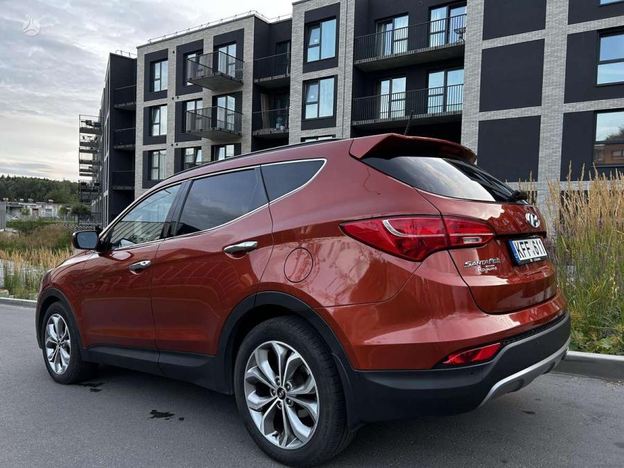 Orange Hyundai Santa Fe 2015 in Vilnius, with an engine capacity of 2.00 L and mileage of 100 thousand km for 12999 €, photo 9 on AUTOMOTO.COM.LV