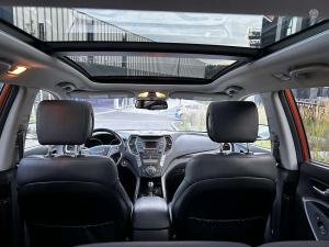 Orange Hyundai Santa Fe 2015 in Vilnius, with an engine capacity of 2.00 L and mileage of 100 thousand km for 12999 €, photo 11 on AUTOMOTO.COM.LV