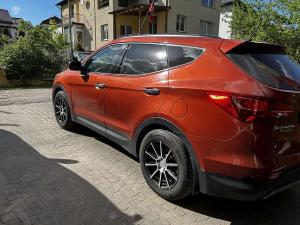 Orange Hyundai Santa Fe 2015 in Vilnius, with an engine capacity of 2.00 L and mileage of 100 thousand km for 12999 €, photo 19 on AUTOMOTO.COM.LV