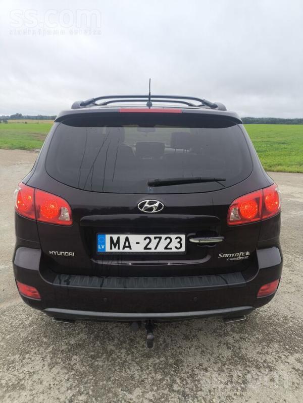 Red Hyundai Santa Fe 2007 in Dobele, with an engine capacity of 2.20 L and mileage of 339 thousand km for 4300 €, photo 6 on AUTOMOTO.COM.LV