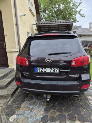 Red Hyundai Santa Fe 2007 in Panevezys, with an engine capacity of 2.19 L and mileage of 220 thousand km for 2700 €, photo 4 on AUTOMOTO.COM.LV