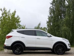 White Hyundai Santa Fe 2013 in Siauliai, with an engine capacity of 2.20 L and mileage of 171 thousand km for 13450 €, photo 15 on AUTOMOTO.COM.LV