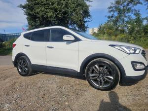 White Hyundai Santa Fe 2013 in Kaunas, with an engine capacity of 2.20 L and mileage of 253 thousand km for 8600 €, photo 6 on AUTOMOTO.COM.LV