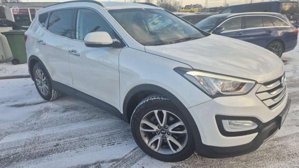 White Hyundai Santa Fe 2015 in Kaunas, with an engine capacity of 2.00 L and mileage of 106 thousand km for 12500 €, photo 3 on AUTOMOTO.COM.LV
