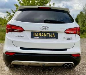 White Hyundai Santa Fe 2015 in Siauliai, with an engine capacity of 2.20 L and mileage of 195 thousand km for 14999 €, photo 7 on AUTOMOTO.COM.LV