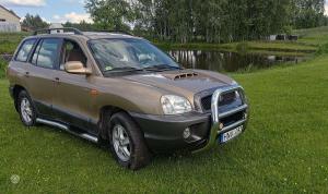 Yellow Hyundai Santa Fe 2002 in Vilnius, with an engine capacity of 1.99 L and mileage of 312 thousand km for 1500 €, photo 3 on AUTOMOTO.COM.LV