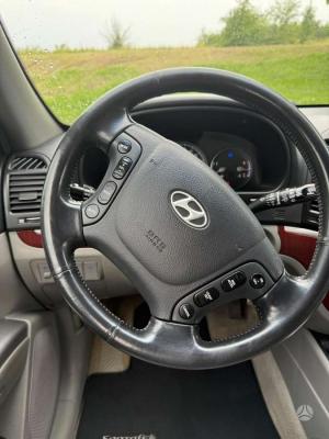 Yellow Hyundai Santa Fe 2006 in Kaunas, with an engine capacity of 2.66 L and mileage of 145 thousand km for 3849 €, photo 14 on AUTOMOTO.COM.LV