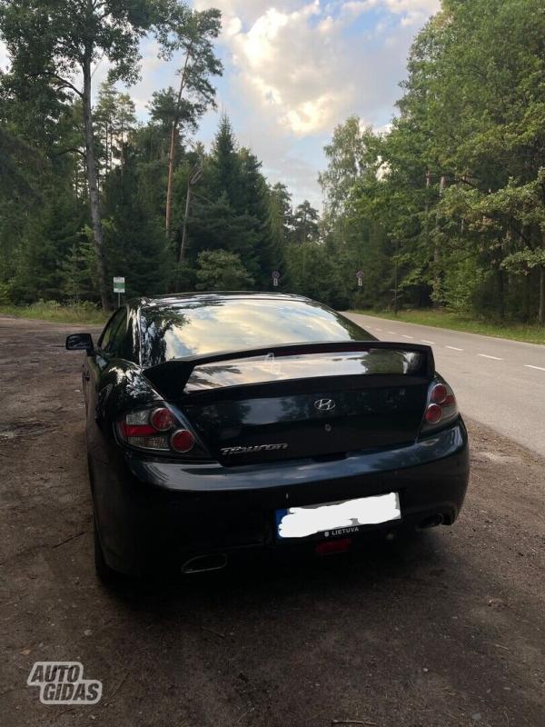 Black Hyundai Tiburon 2007 in Kaunas, with an engine capacity of 2.00 L and mileage of 215 thousand km for 3900 €, photo 4 on AUTOMOTO.COM.LV