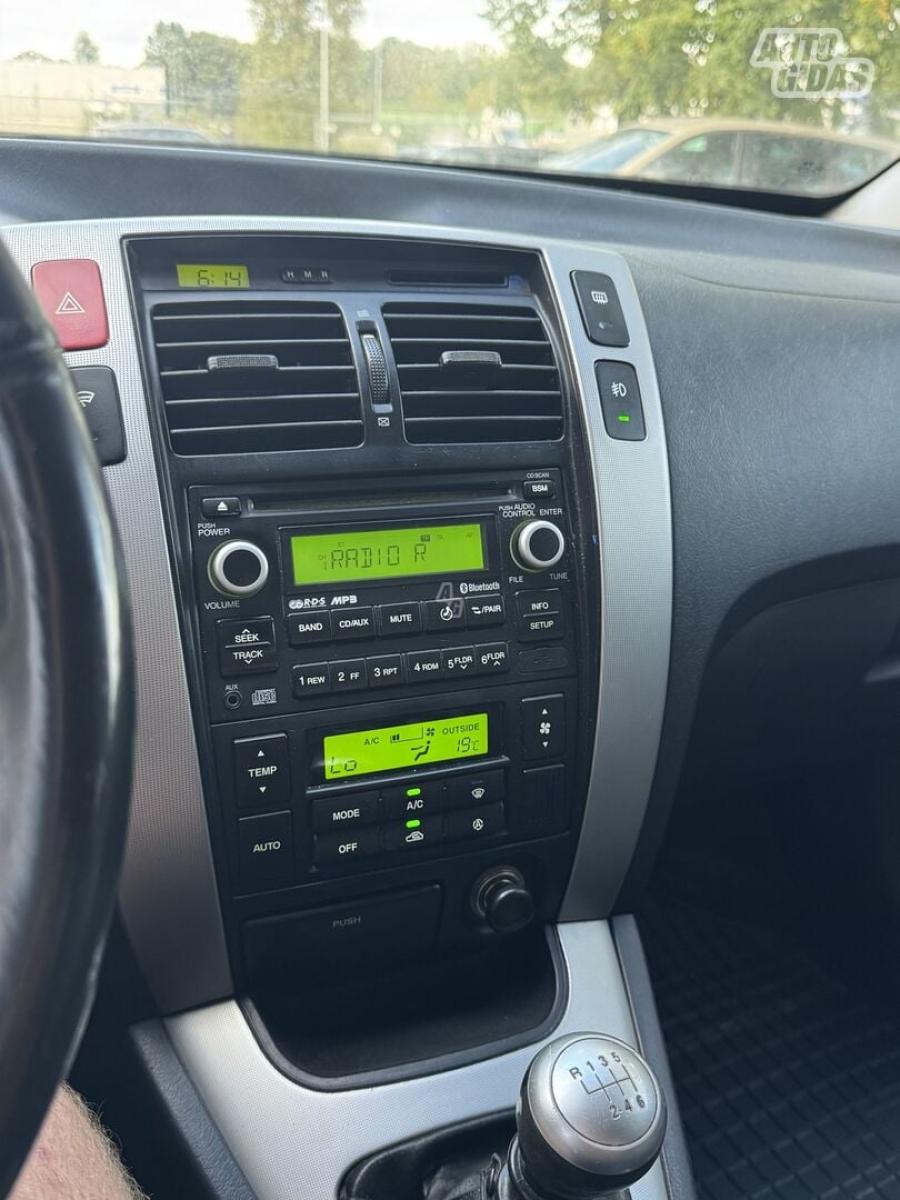 Black Hyundai Tucson 2008 in Vilnius, with an engine capacity of 2.00 L and mileage of 309 thousand km for 1799 €, photo 14 on AUTOMOTO.COM.LV