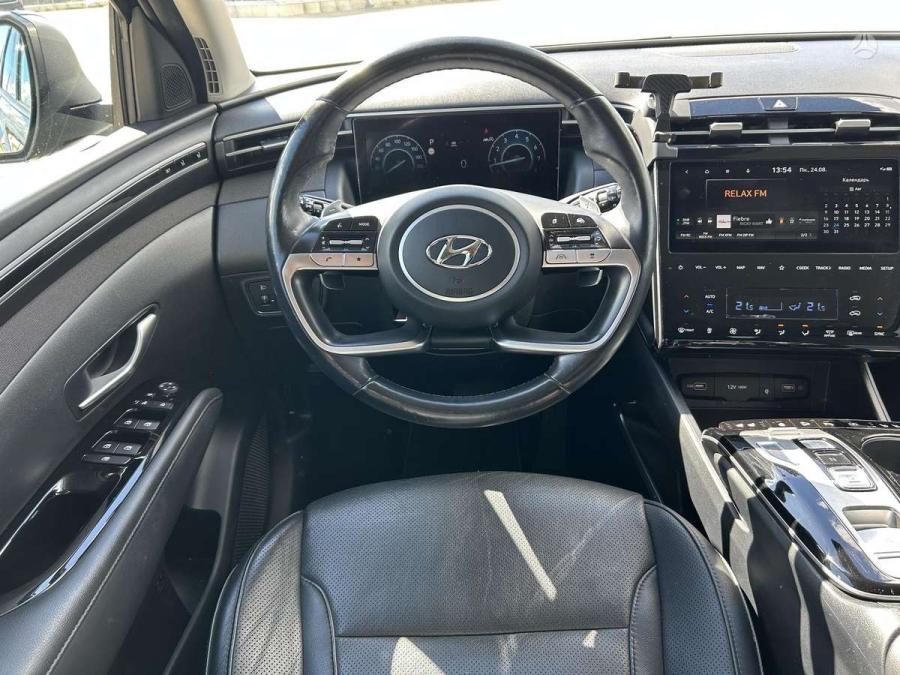Black Hyundai Tucson 2021 in Vilnius, with an engine capacity of 1.60 L and mileage of 83 thousand km for 25400 €, photo 12 on AUTOMOTO.COM.LV