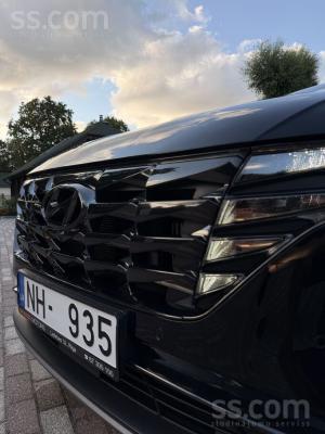 Black Hyundai Tucson 2022 in Riga, with an engine capacity of 1.60 L and mileage of 63 thousand km for 23000 €, photo 4 on AUTOMOTO.COM.LV