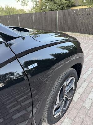 Black Hyundai Tucson 2022 in Riga, with an engine capacity of 1.60 L and mileage of 63 thousand km for 23000 €, photo 6 on AUTOMOTO.COM.LV