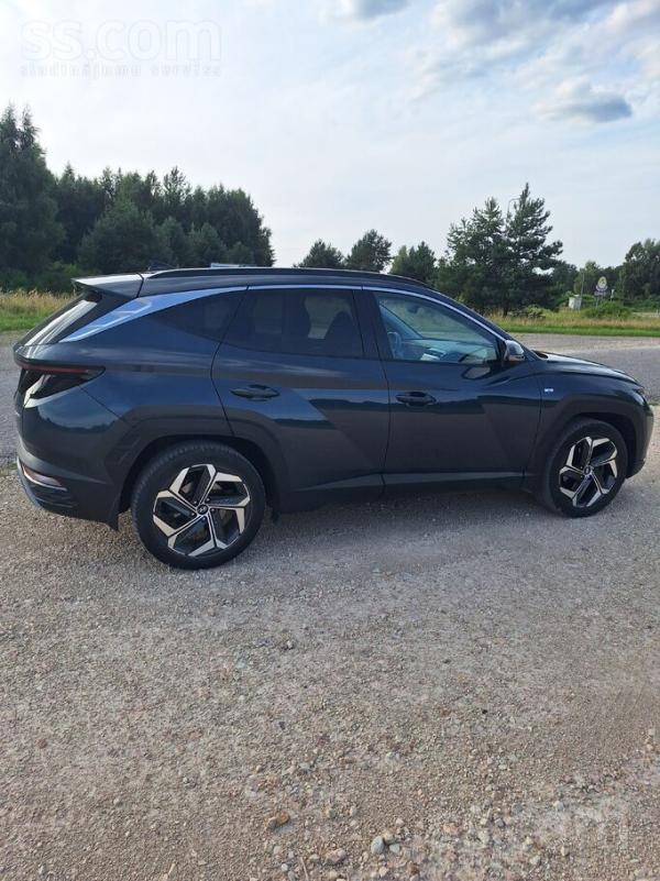 Blue Hyundai Tucson 2024 in Riga, with an engine capacity of 1.60 L and mileage of 58 thousand km for 28000 €, photo 3 on AUTOMOTO.COM.LV