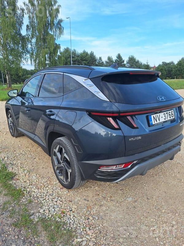 Blue Hyundai Tucson 2024 in Riga, with an engine capacity of 1.60 L and mileage of 58 thousand km for 28000 €, photo 4 on AUTOMOTO.COM.LV