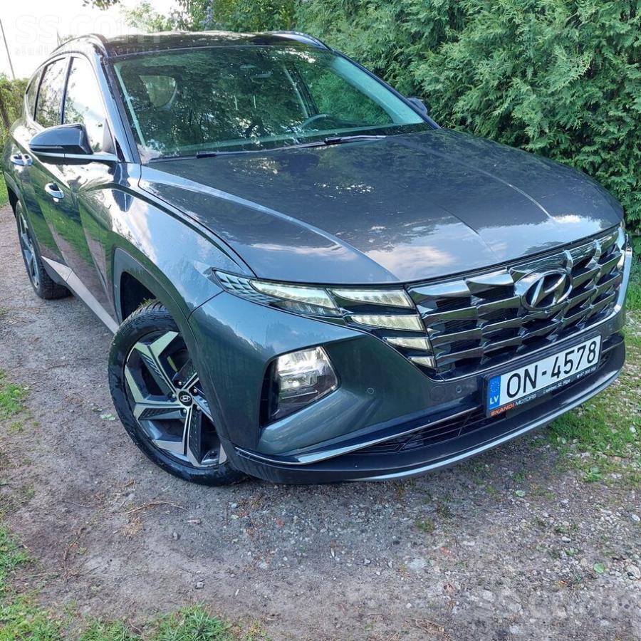 Grey Hyundai Tucson 2021 in Riga, with an engine capacity of 1.60 L and mileage of 54 thousand km for 21777 €, photo 1 on AUTOMOTO.COM.LV