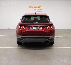 Red Hyundai Tucson 2022 in Riga, with an engine capacity of 1.60 L and mileage of 99 thousand km for 24490 €, photo 5 on AUTOMOTO.COM.LV