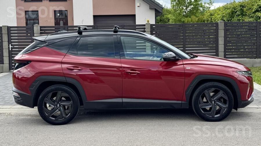 Red Hyundai Tucson 2023 in Riga, with an engine capacity of 1.60 L and mileage of 88 thousand km for 23650 €, photo 6 on AUTOMOTO.COM.LV
