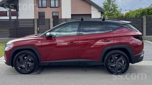Red Hyundai Tucson 2023 in Riga, with an engine capacity of 1.60 L and mileage of 88 thousand km for 23650 €, photo 7 on AUTOMOTO.COM.LV