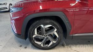 Red Hyundai Tucson 2023 in Riga, with an engine capacity of 1.60 L and mileage of 53 thousand km for 25500 €, photo 8 on AUTOMOTO.COM.LV