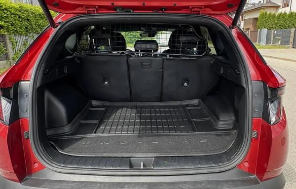 Red Hyundai Tucson 2023 in Riga, with an engine capacity of 1.60 L and mileage of 88 thousand km for 23950 €, photo 9 on AUTOMOTO.COM.LV