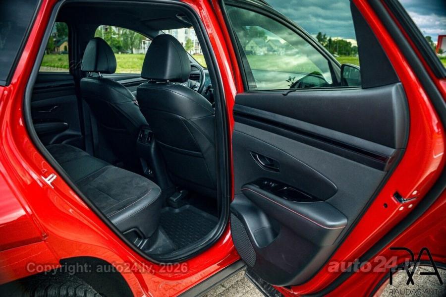 Red Hyundai Tucson 2023 in Riga, with an engine capacity of 1.60 L and mileage of 104 thousand km for 21990 €, photo 18 on AUTOMOTO.COM.LV