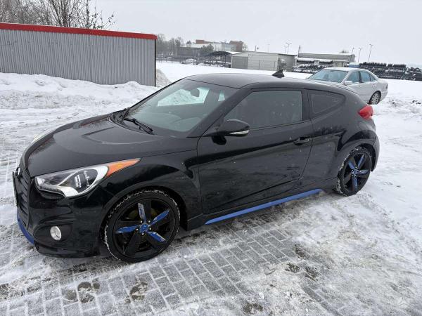 Black Hyundai Veloster 2013 in Kaunas, with an engine capacity of 1.59 L and mileage of 133 thousand km for 4900 €, photo 1 on AUTOMOTO.COM.LV