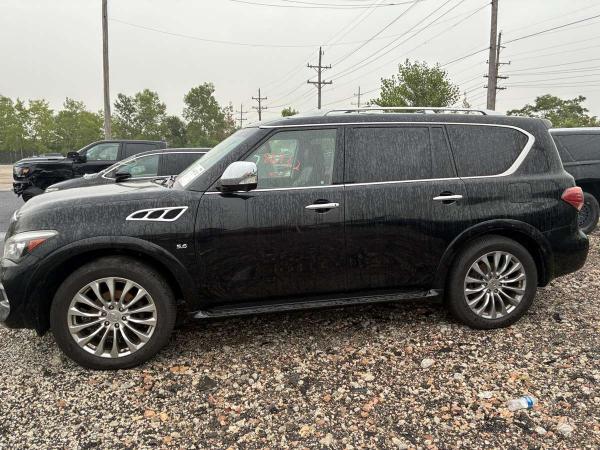 Black Infiniti QX80 2015 in Vilnius, with an engine capacity of 5.55 L and mileage of 293 thousand km for 8500 €, photo 6 on AUTOMOTO.COM.LV