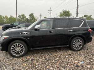 Black Infiniti QX80 2015 in Vilnius, with an engine capacity of 5.55 L and mileage of 293 thousand km for 8500 €, photo 6 on AUTOMOTO.COM.LV