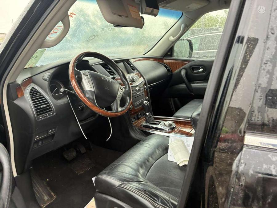 Black Infiniti QX80 2015 in Vilnius, with an engine capacity of 5.55 L and mileage of 293 thousand km for 8500 €, photo 11 on AUTOMOTO.COM.LV