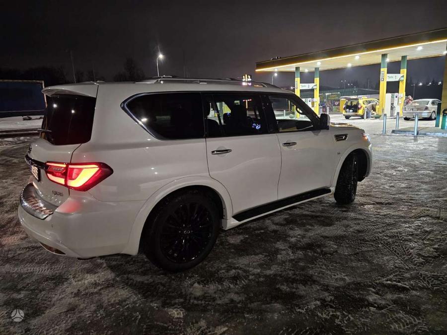 White Infiniti QX80 2019 in Vilnius, with an engine capacity of 5.55 L and mileage of 120 thousand km for 32000 €, photo 4 on AUTOMOTO.COM.LV