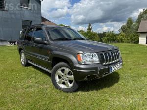 Pelēks Jeep Cherokee 2004 Dobele, ar dzinēja tilpumu 4.70 L un nobraukumu 135 tūkst. km par 14300 €, foto 1 vietnē AUTOMOTO.COM.LV