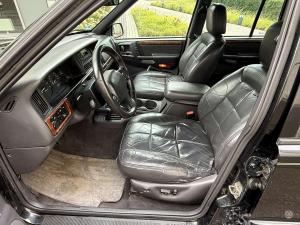 Black Jeep Grand Cherokee 1997 in Vilnius, with an engine capacity of 5.21 L and mileage of 461 thousand km for 5500 €, photo 11 on AUTOMOTO.COM.LV