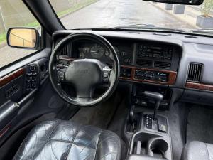 Black Jeep Grand Cherokee 1997 in Vilnius, with an engine capacity of 5.21 L and mileage of 461 thousand km for 5500 €, photo 24 on AUTOMOTO.COM.LV