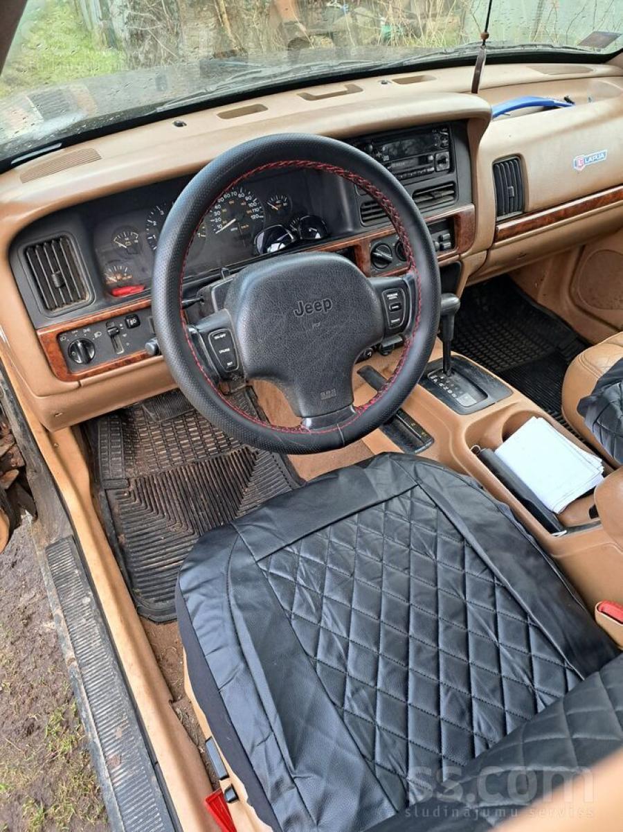 Black Jeep Grand Cherokee 1998 in Dobele, with an engine capacity of 5.20 L and mileage of 170 thousand km for 3800 €, photo 3 on AUTOMOTO.COM.LV