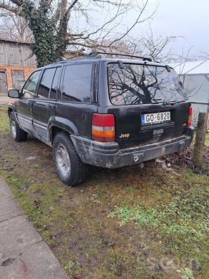Black Jeep Grand Cherokee 1998 in Dobele, with an engine capacity of 5.20 L and mileage of 170 thousand km for 3800 €, photo 4 on AUTOMOTO.COM.LV