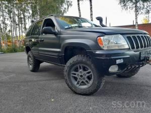 Black Jeep Grand Cherokee 1999 in Riga, with an engine capacity of 4.70 L and mileage of 213 thousand km for 4200 €, photo 4 on AUTOMOTO.COM.LV