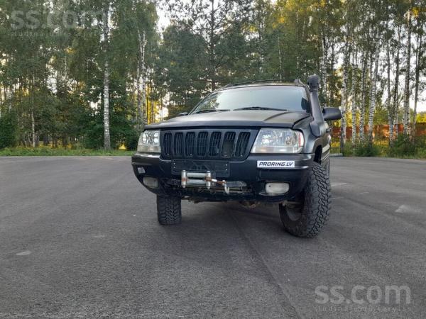 Black Jeep Grand Cherokee 1999 in Riga, with an engine capacity of 4.70 L and mileage of 213 thousand km for 4200 €, photo 5 on AUTOMOTO.COM.LV