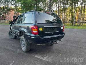 Black Jeep Grand Cherokee 1999 in Riga, with an engine capacity of 4.70 L and mileage of 213 thousand km for 4200 €, photo 8 on AUTOMOTO.COM.LV