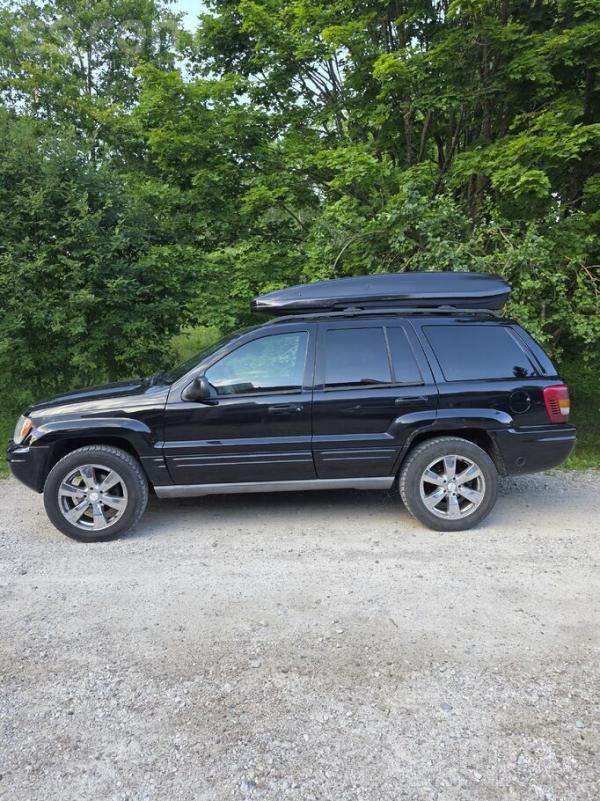 Black Jeep Grand Cherokee 1999 in Talsi, with an engine capacity of 4.70 L and mileage of 340 thousand km for 1950 €, photo 2 on AUTOMOTO.COM.LV