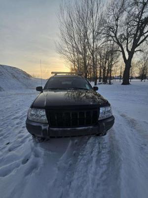 Black Jeep Grand Cherokee 2001 in Panevezys, with an engine capacity of 4.70 L and mileage of 206 thousand km for 3700 €, photo  on AUTOMOTO.COM.LV
