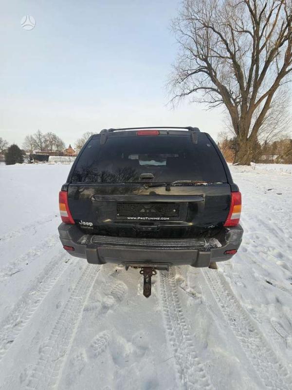 Black Jeep Grand Cherokee 2001 in Panevezys, with an engine capacity of 4.70 L and mileage of 206 thousand km for 3700 €, photo 2 on AUTOMOTO.COM.LV