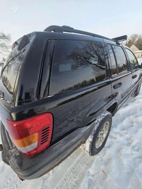Black Jeep Grand Cherokee 2001 in Panevezys, with an engine capacity of 4.70 L and mileage of 206 thousand km for 3700 €, photo 7 on AUTOMOTO.COM.LV