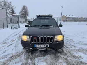 Black Jeep Grand Cherokee 2001 in Jonava, with an engine capacity of 3.12 L and mileage of 200 thousand km for 1900 €, photo  on AUTOMOTO.COM.LV