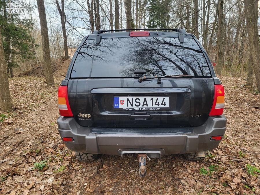 Melns Jeep Grand Cherokee 2001 Panevēža, ar dzinēja tilpumu 4.70 L un nobraukumu 207 tūkst. km par 4500 €, foto 7 vietnē AUTOMOTO.COM.LV