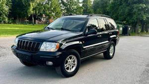 Black Jeep Grand Cherokee 2001 in Silute, with an engine capacity of 4.70 L and mileage of 125 thousand km for 5200 €, photo  on AUTOMOTO.COM.LV