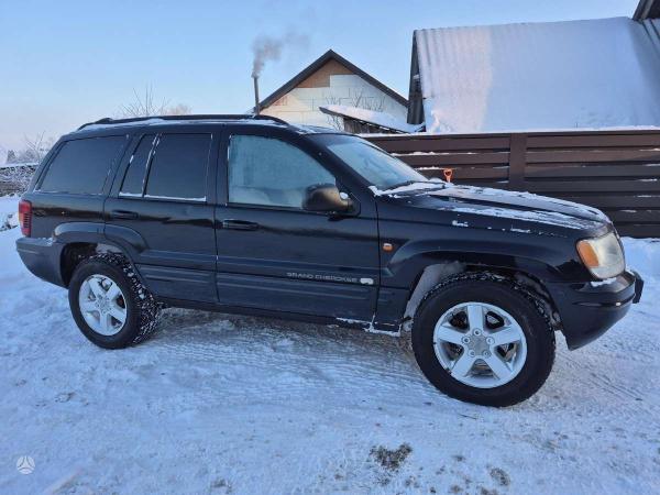Black Jeep Grand Cherokee 2002 in Vilnius, with an engine capacity of 4.70 L and mileage of 340 thousand km for 3300 €, photo 2 on AUTOMOTO.COM.LV